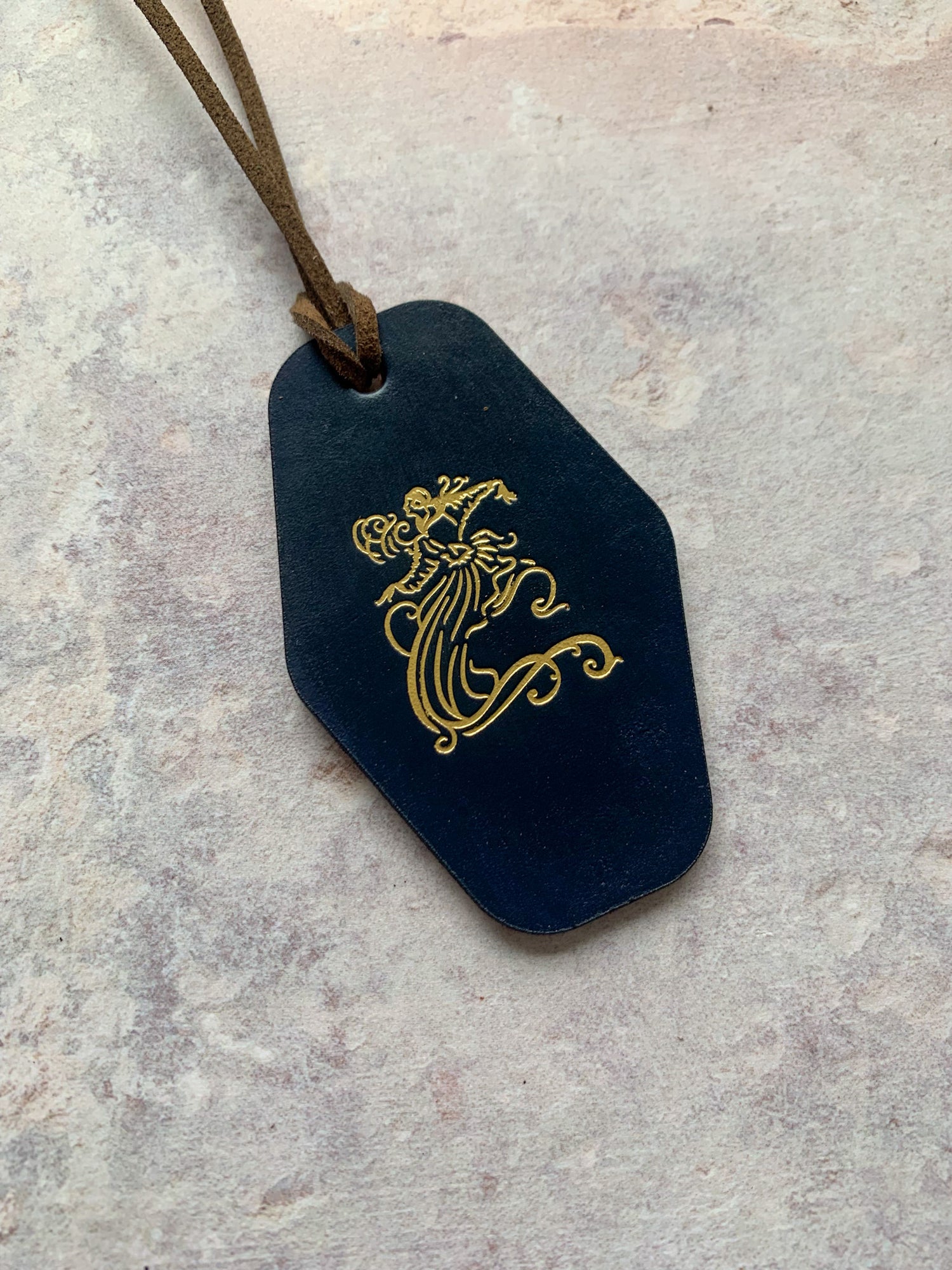 Bespoke cloakroom tags with your company logo on. – Parkin and Lewis
